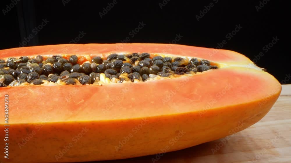 The captivating world of a half papaya through a mesmerizing macro ...
