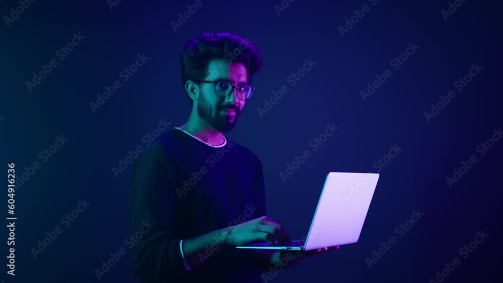 Arabian Man With Laptop At Neon Ultraviolet Background Indian Guy Male Coder Programmer Worker