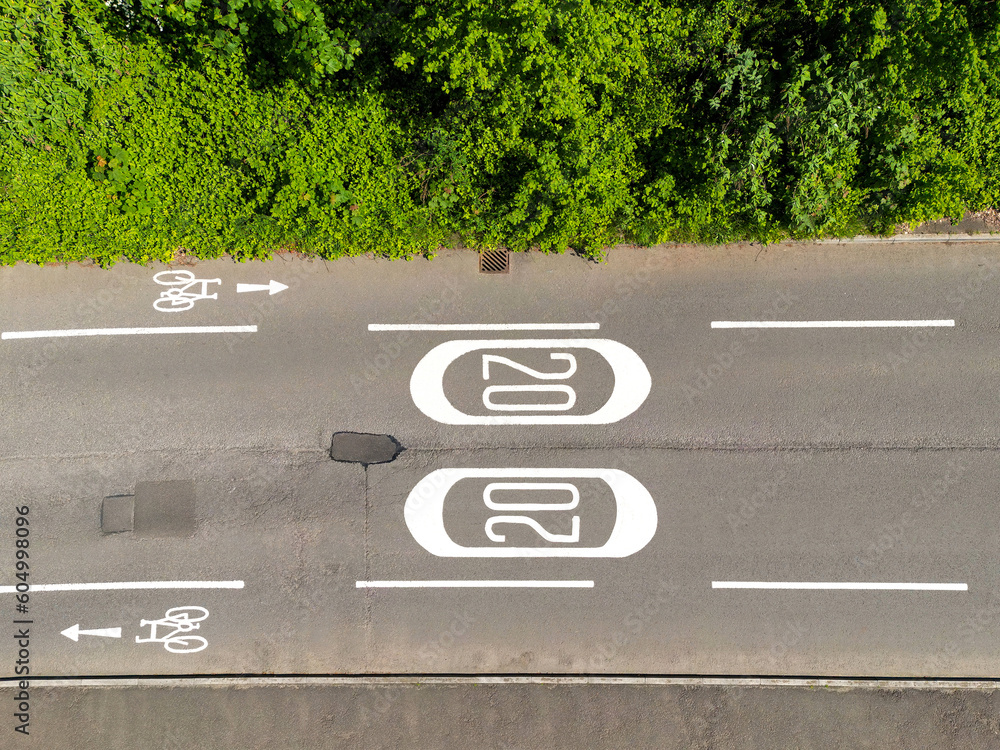Aerial view of road markings for a 20 mph speed limit zone and cycle ...