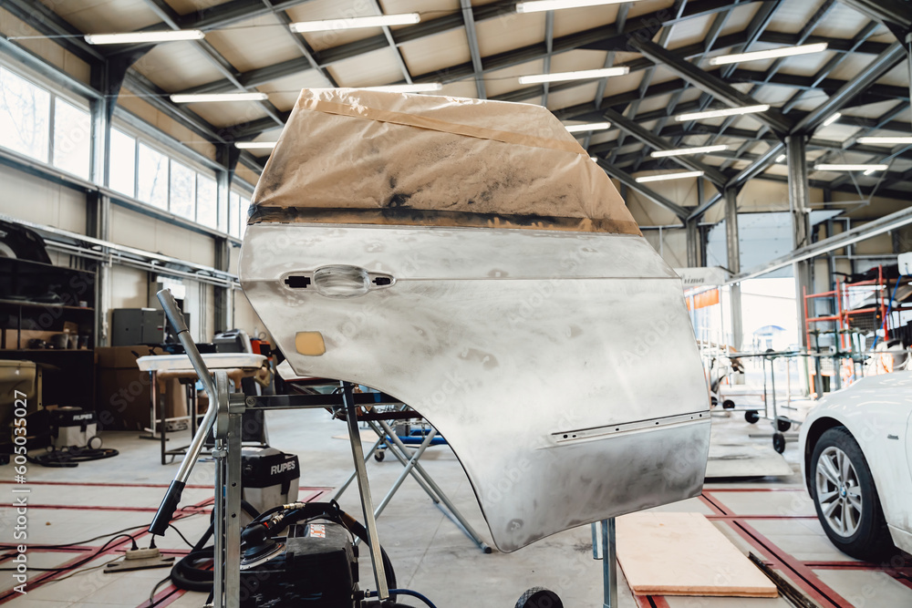The car body after the accident is covered with putty, primer before ...