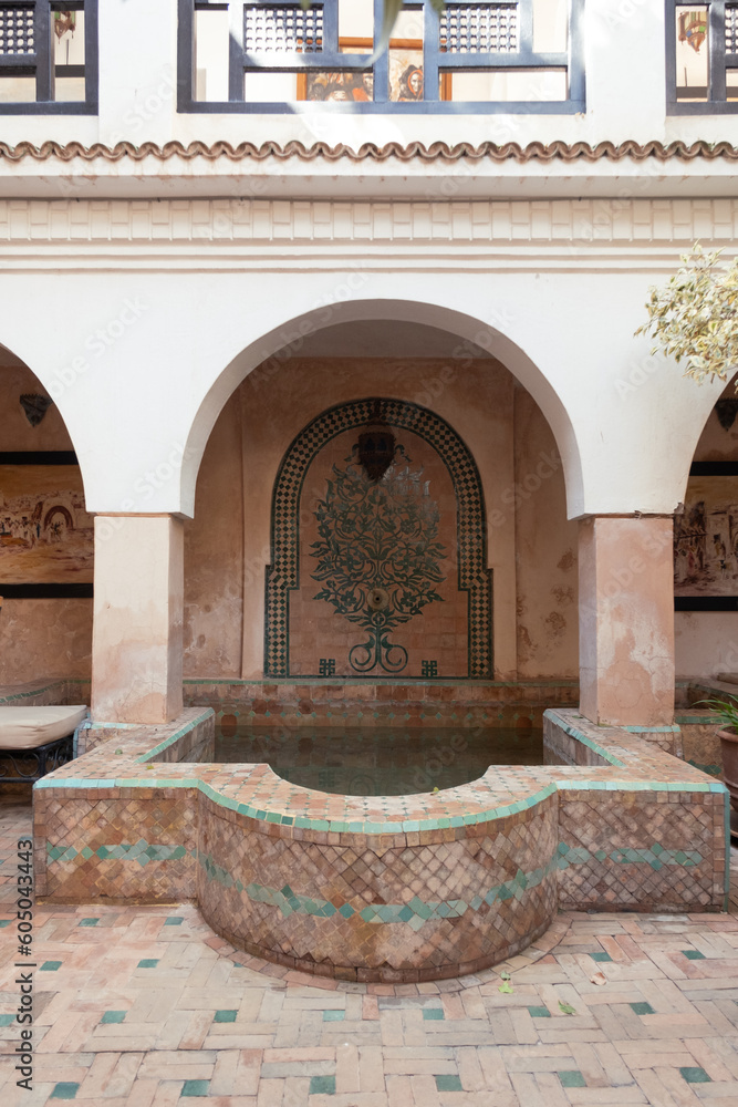 Moroccan indoor bath or pools with moorish arches, arabic tiles and ...