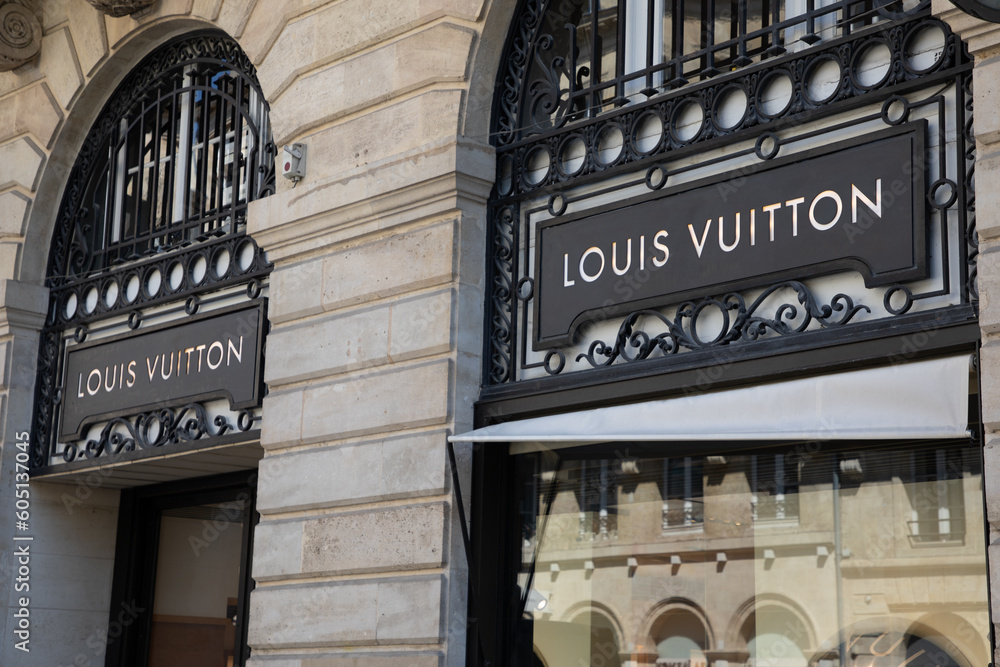 louis vuitton logo brand and sign text front wall facade up store ...