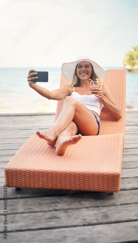 Woman Lounge Selfie And Cocktail On Tropical Holiday By The Ocean On Deck Chair With A Smile