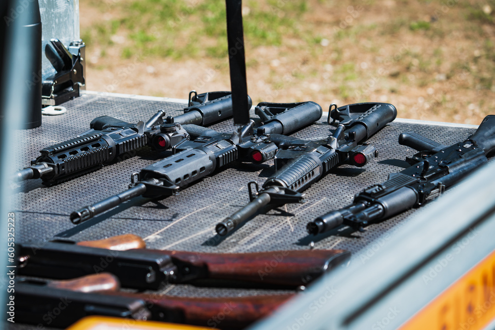 Firearms, m4a1 and ak47 rifles in the car trailer. Stock Photo | Adobe ...