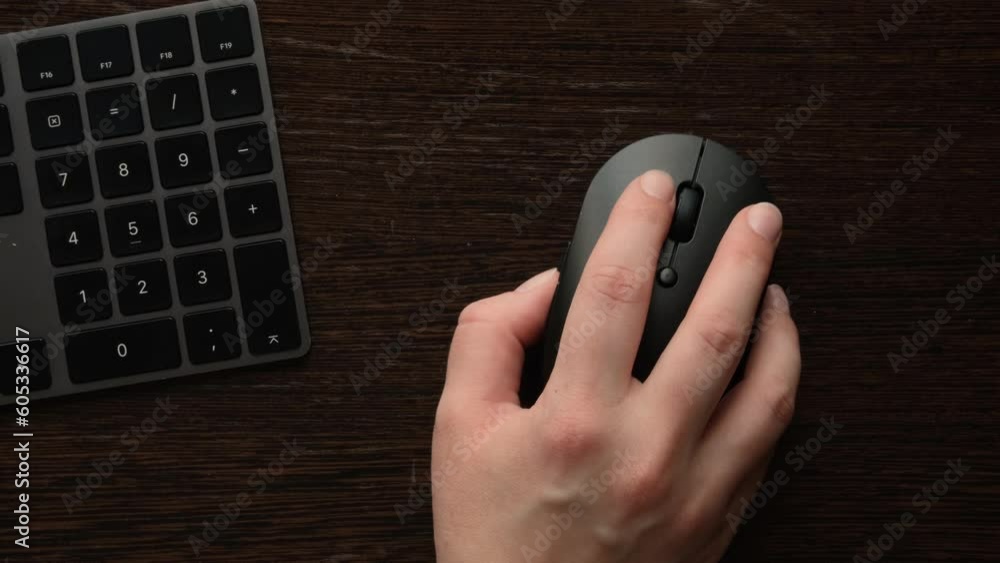 Computer work. Hand clicks the mouse close up. Desk top view. 4K ...