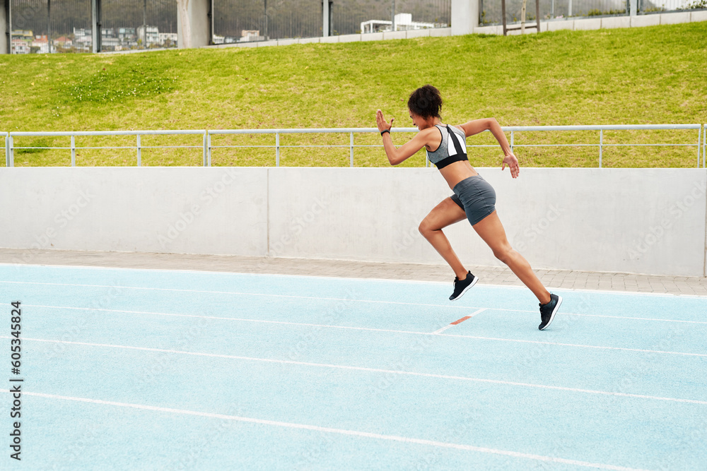 Woman, fitness and running on track for cardio training, exercise or ...