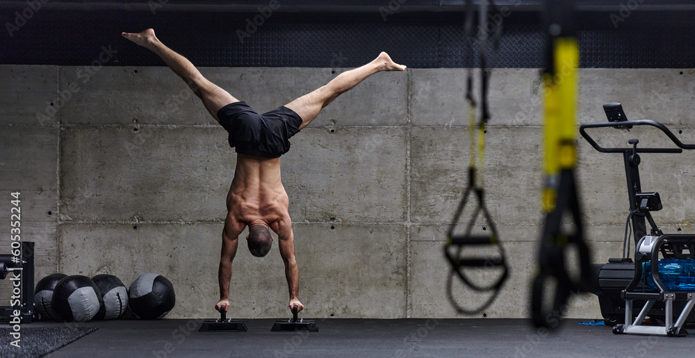 A muscular man in a handstand position, showcasing his exceptional ...