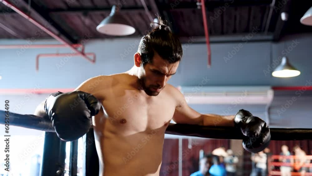 Close-up young athlete who specializes in boxing, leaning against long ...