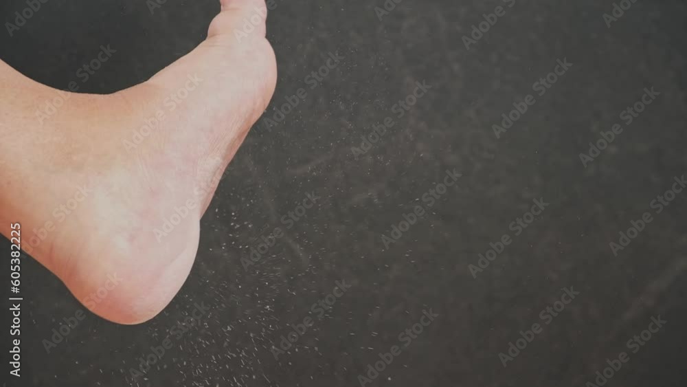 A metallic foot file for pedicure. One side is rough. It is designed to ...