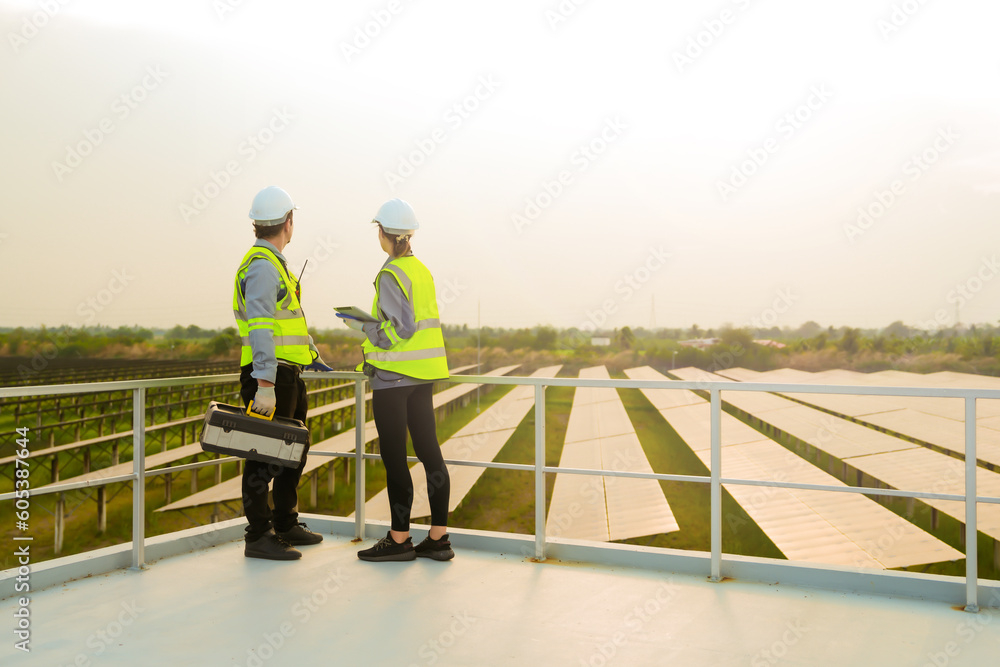 Engineers inspecting construction of solar panel at roof top. solar ...