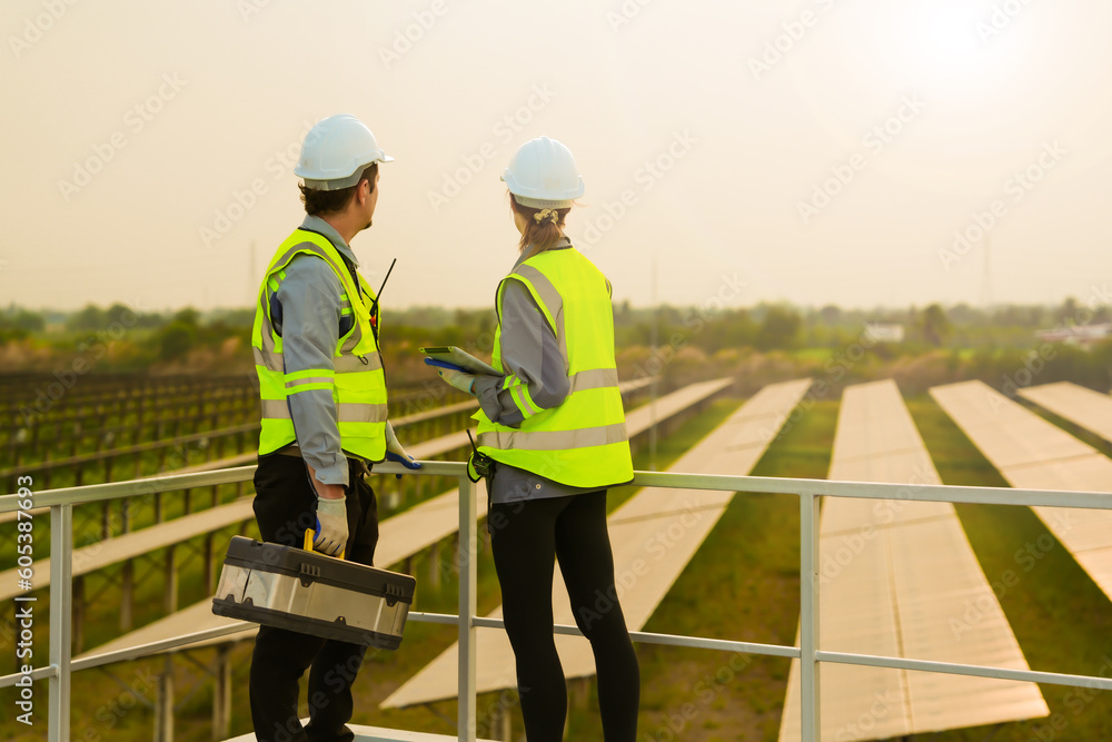 Engineers inspecting construction of solar panel at roof top. solar ...