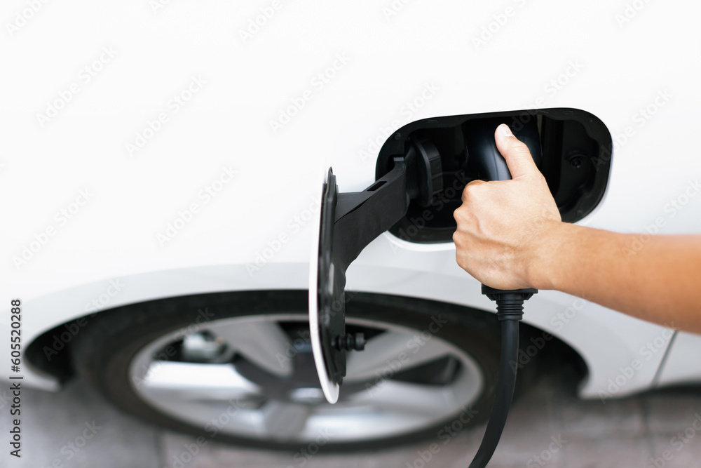 High view progressive concept of hand insert an emission-free power ...