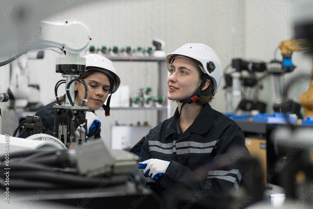Team of female engineer control autonomous mobile robot or AMR in the ...