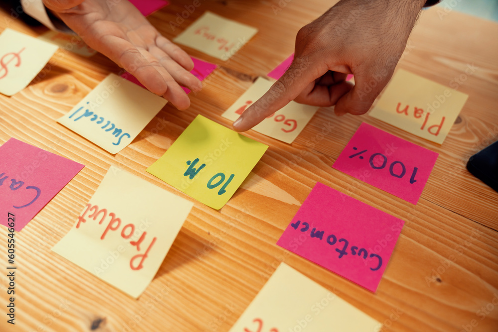 Business team gather on table, brainstorming and writing creative idea ...
