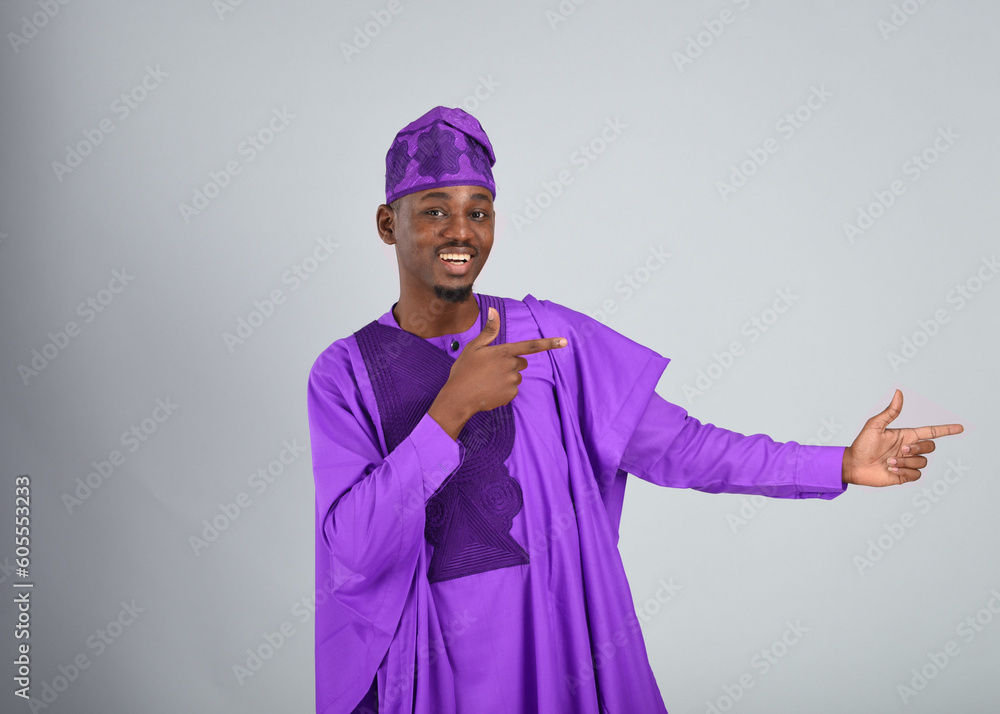 Black African Nigeria Yoruba wearing purple agbada traditional clothes ...