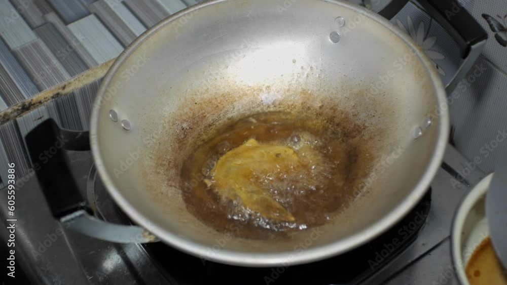 Frying the chicken on a griddle using hot cooking oil raises the foam ...