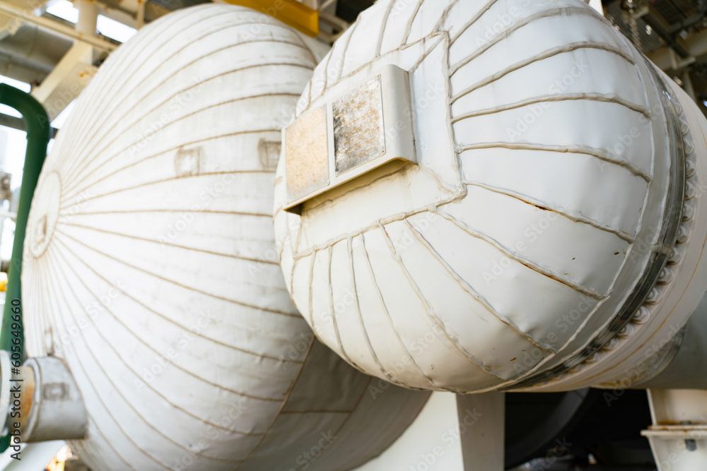 The heated encapsulated pressure vessel is protected by insulation to ...
