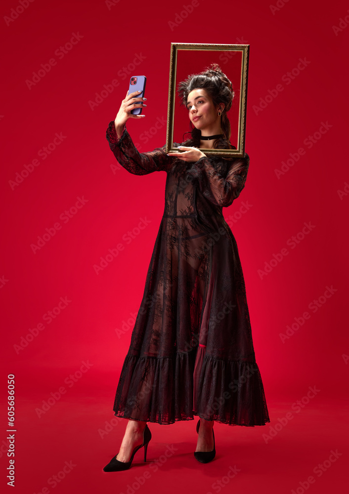 Full-length portrait of tender, beautiful, young girl holding picture ...