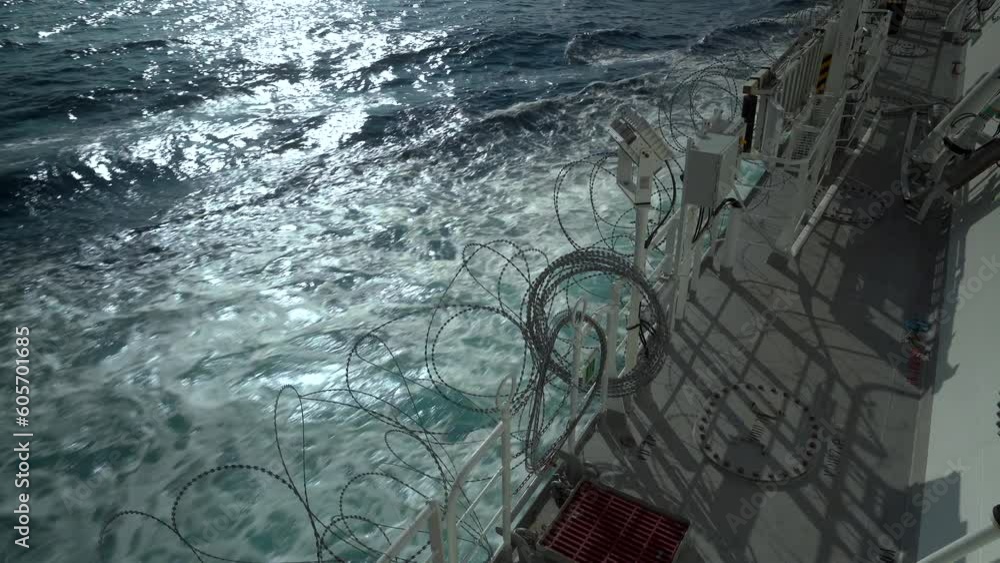 Barbed wire on railing ship. Protection from pirates. Open deck in ...