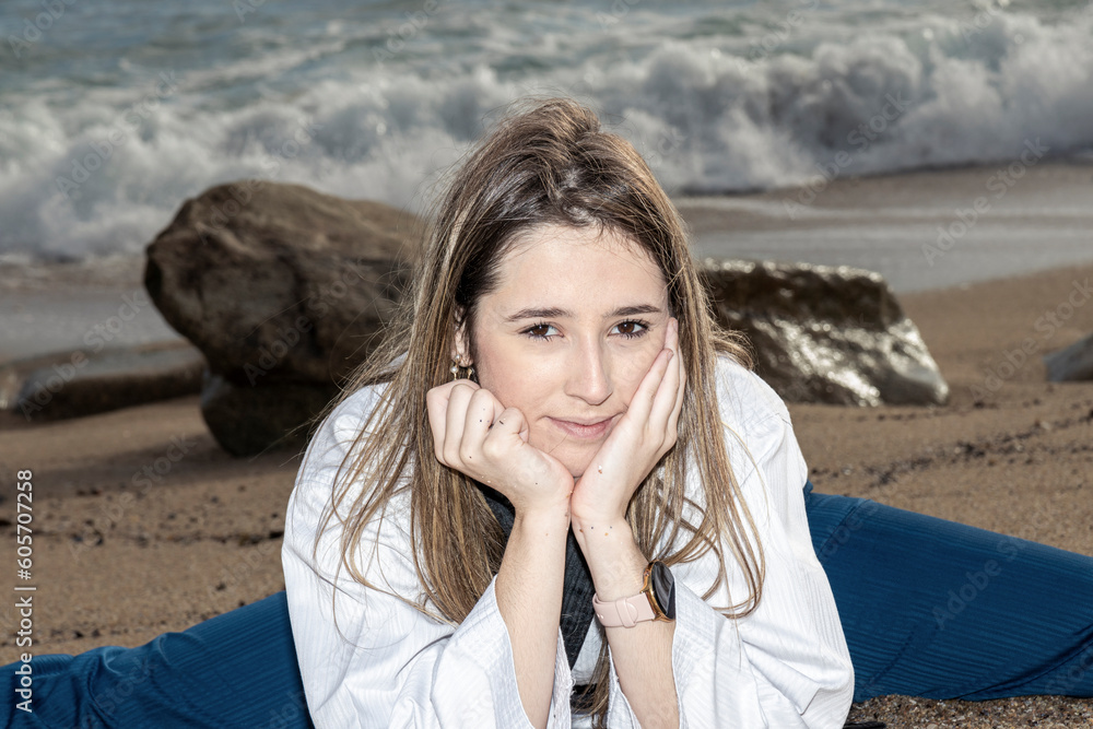 Graceful Flexibility: A Young Woman Mastering the Splits on the Beach ...
