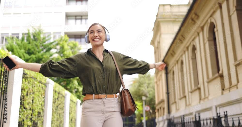 Happy, dance and woman in city, headphones and celebrate in street ...
