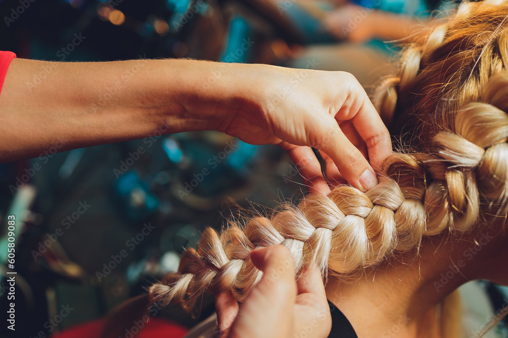 Process of braiding the master weaves braids on her head blond little ...