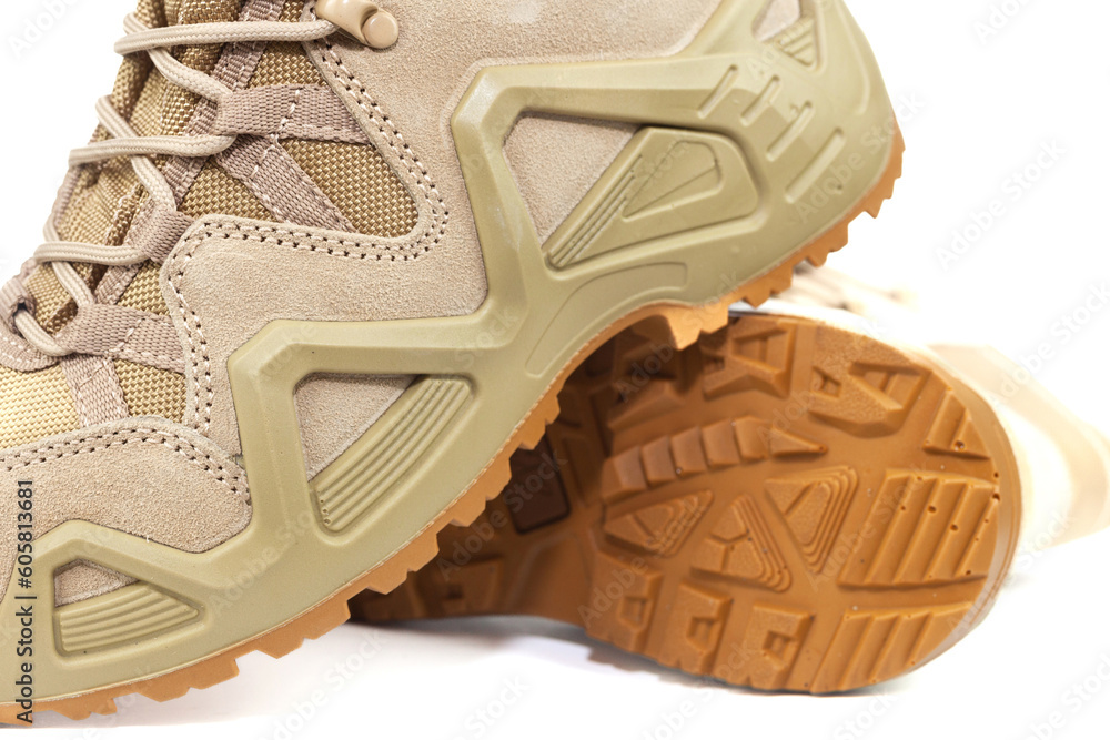 Tactical military boots for the army are cut out on a white background ...