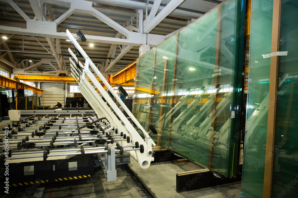 machines working with giant glasses in industrial glass window ...