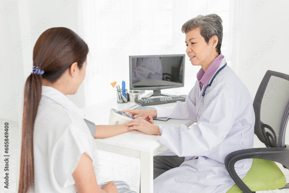 Asian doctor talk with patient about blood pressure, asian doctor use ...