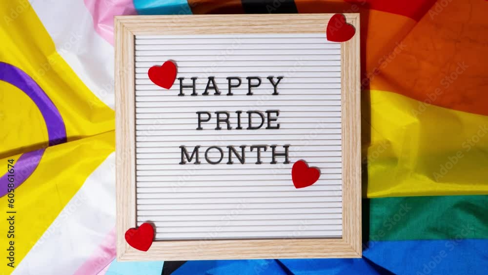 Zoom in out HAPPY PRIDE MONTH frame on Rainbow LGBTQIA flag made from ...