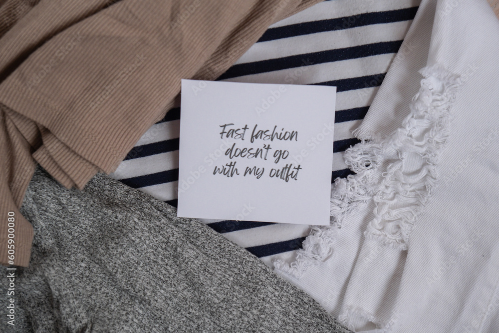 FAST FASHION DOESNT GO WITH MY OUTFIT text on paper note on clothes ...
