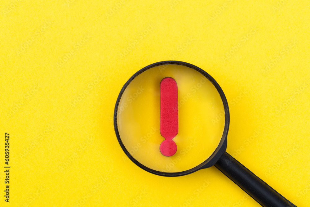Look At The Exclamation Mark With A Magnifying Glass Stock Photo look-at-the-exclamation-mark-with-a-magnifying-glass-stock-photo
