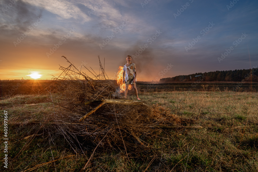 young guy crying in fire in burnt clothes, war, home destruction, human ...