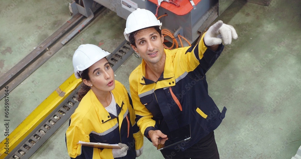 Top view. Young latin technician men and women in safety hard hat ...
