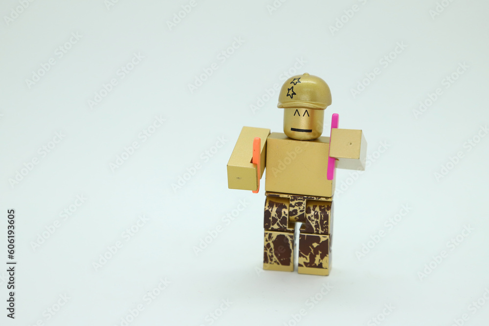 Character doll from the video game Roblox in gold color. Figure of a ...