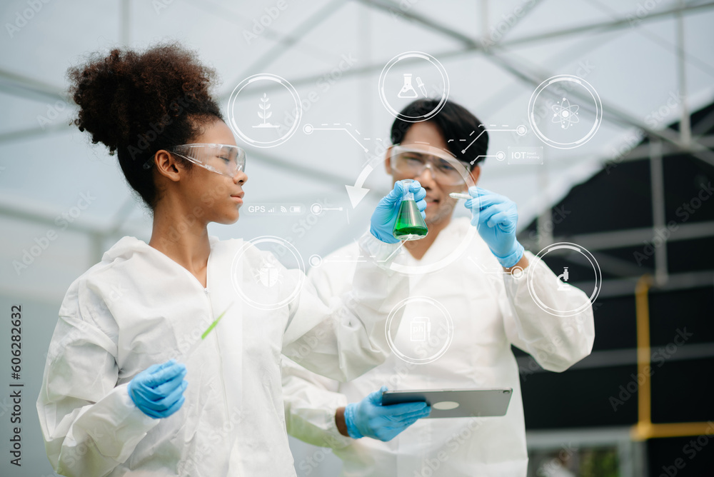 Researcher in white uniform are checking with ph strips in hydroponic ...