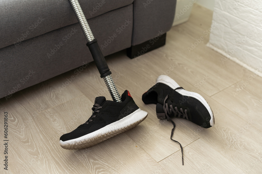 High angle background of disassembled prosthetic leg and foot on table ...