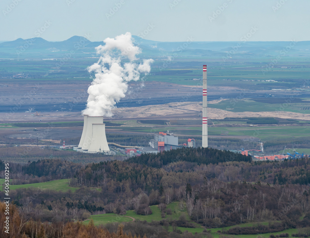 moking coal fired power plant and steam rising from a cooling tower ...