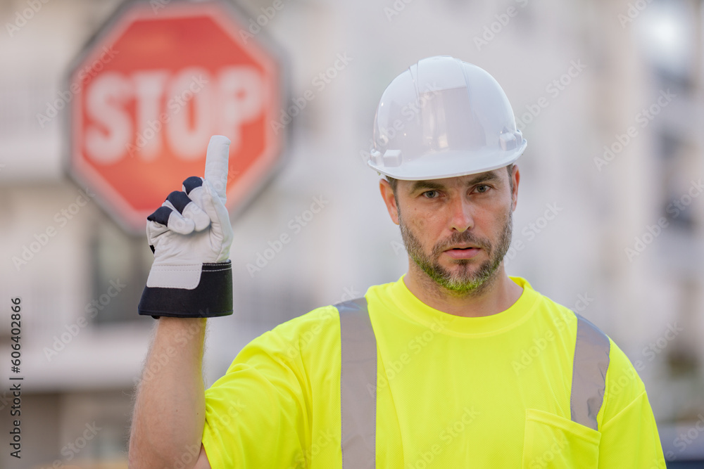 Worker in uniform gesturing stop. Builder with stop gesture, no hand ...