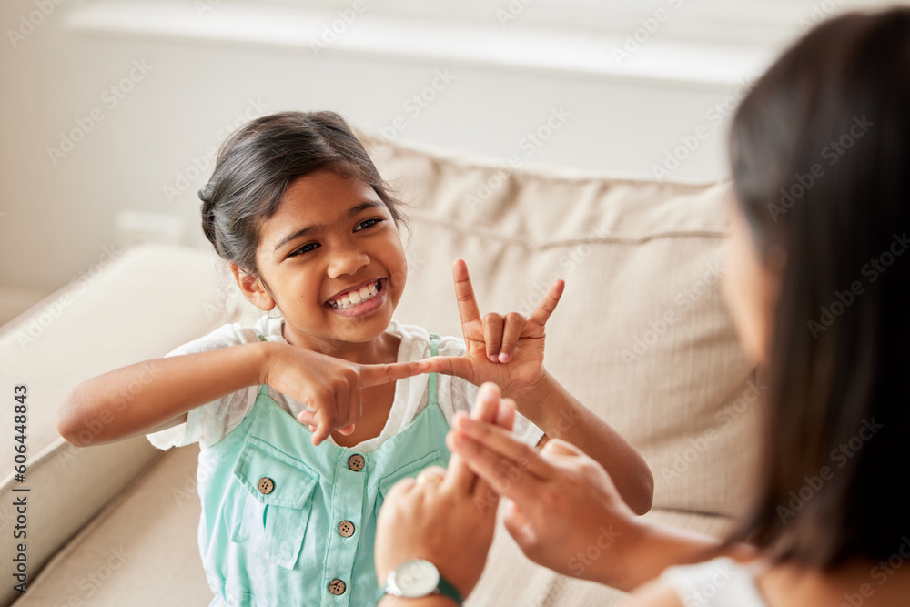 Sign language, communication and child with her mother in the living ...