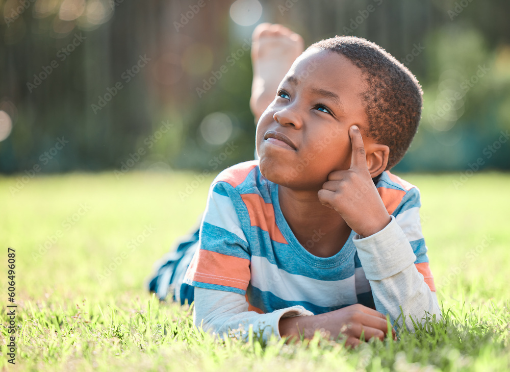 Nature park, black boy thinking and lying on grass outside at park with ...
