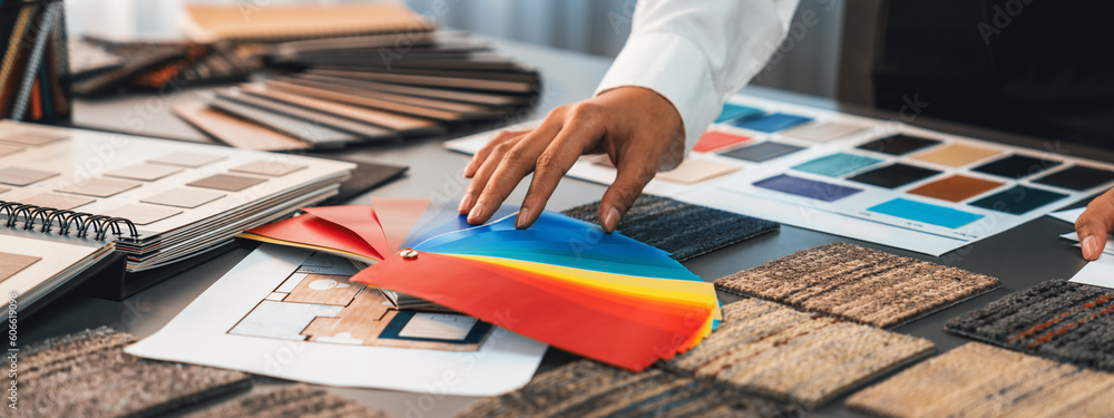 Interior architect designer at workstation table choosing various color ...
