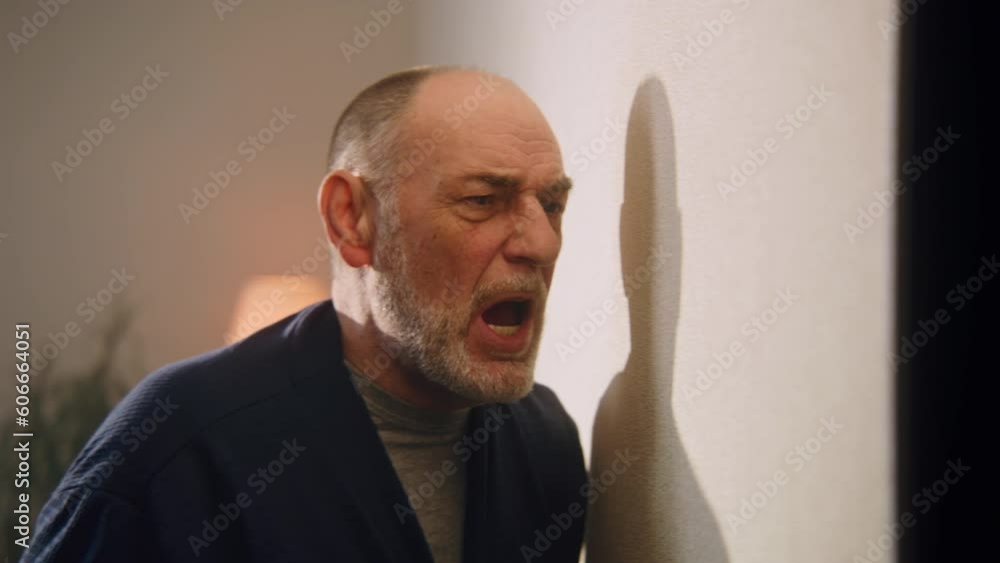 Man screws nail into wall, interferes to neighbor. Happy couple finish ...