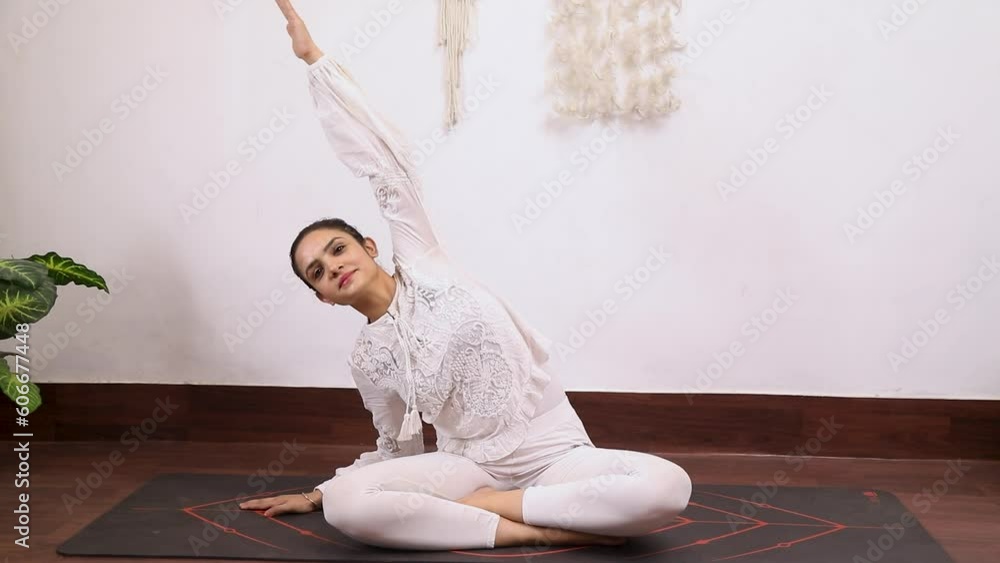 Video of a woman performing Seated Side Bend Pose (Parsva Sukhasana ...