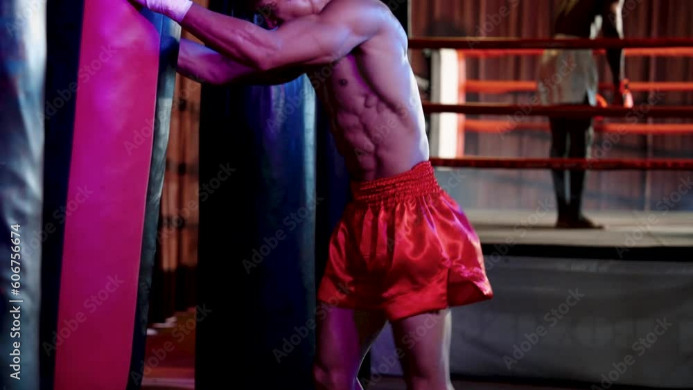 Shirtless Asian male boxer show strong muscles Practice kicking and ...