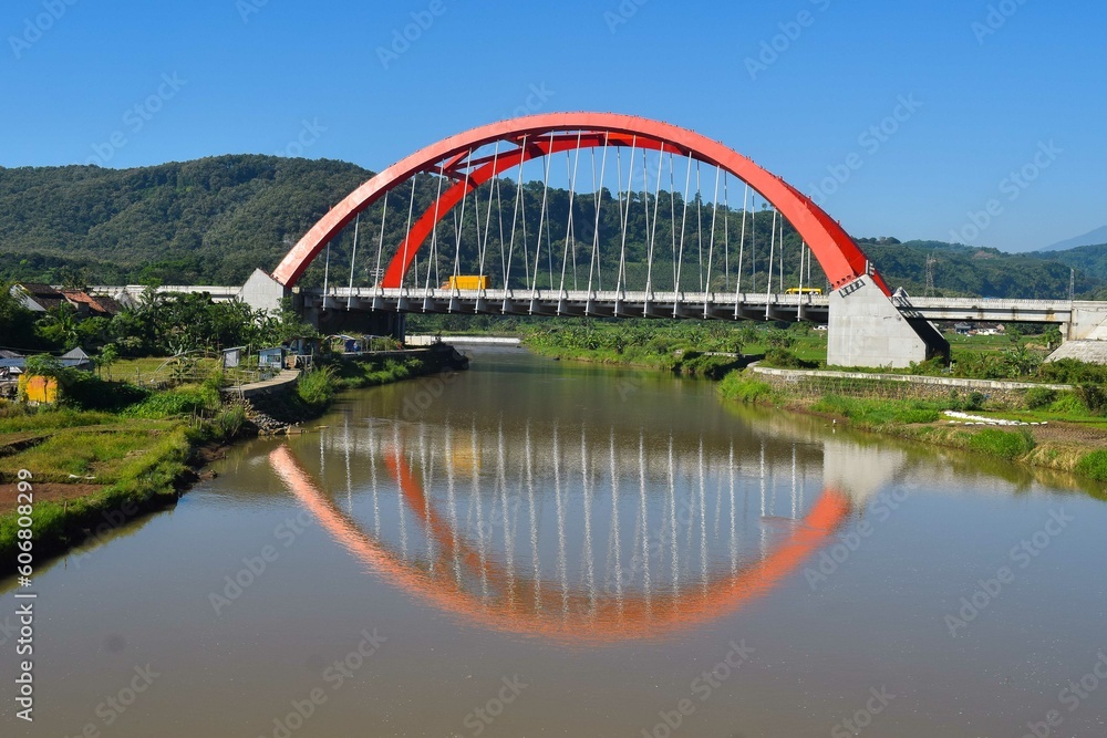 The Red Kalikuto Arch Bridge is part of the Trans Java Toll Road. This ...