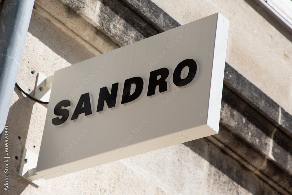 sandro brand text facade store signage and logo sign on shop wall ...
