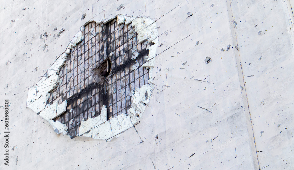 Traces of an artillery shell hitting a multi-storey residential ...