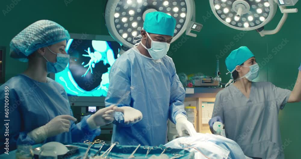 Ethnic diversity. African American doctor performs surgical operation ...
