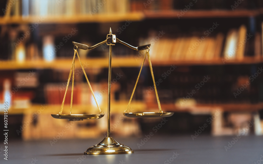 Shiny golden balanced scale in courtroom background as concept justice ...